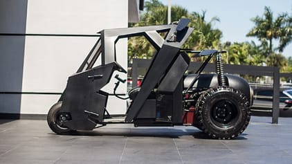 Look, it’s a Batmobile golf cart!