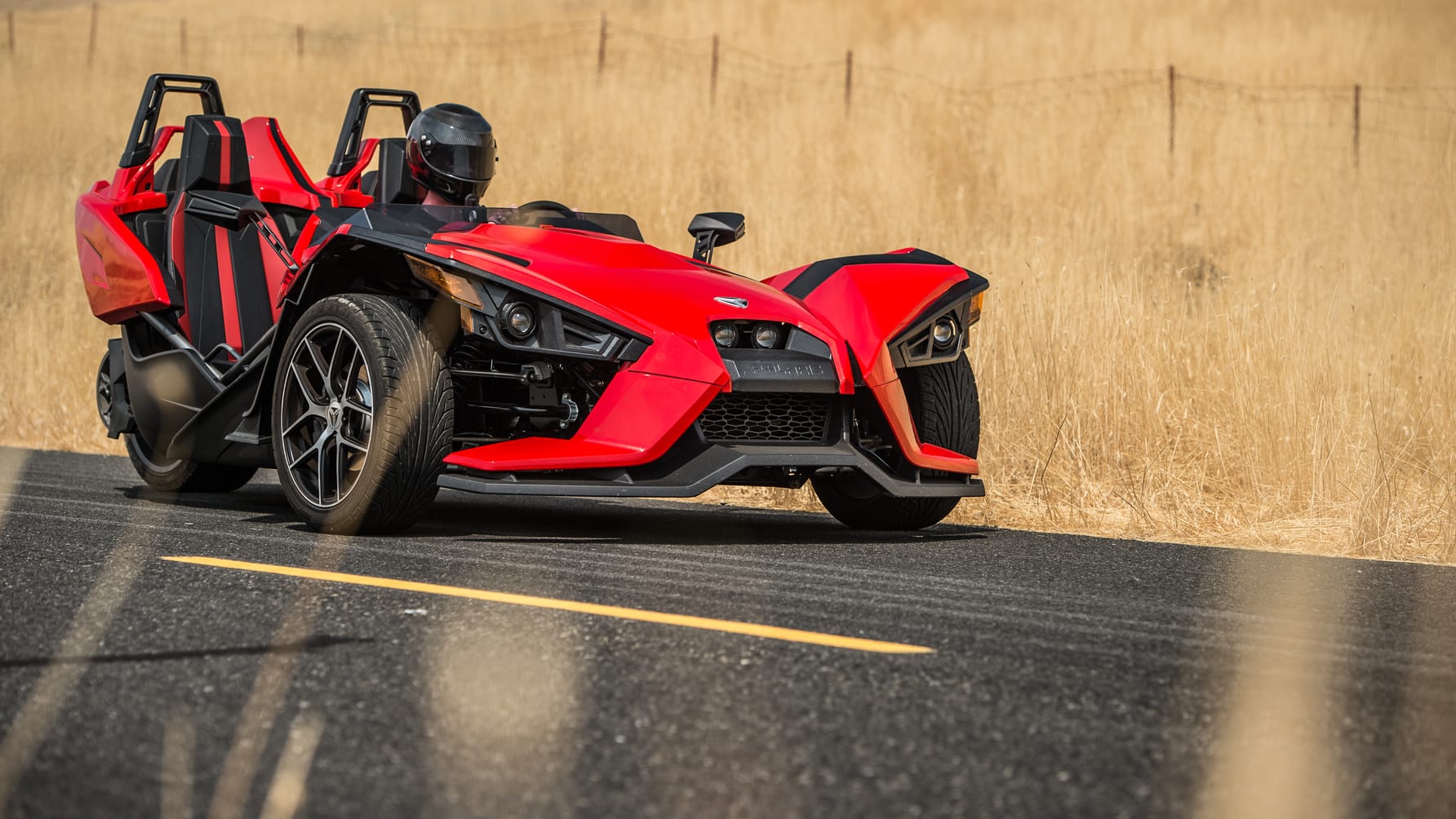 Watch as the Polaris Slingshot goes longboarding | Top Gear