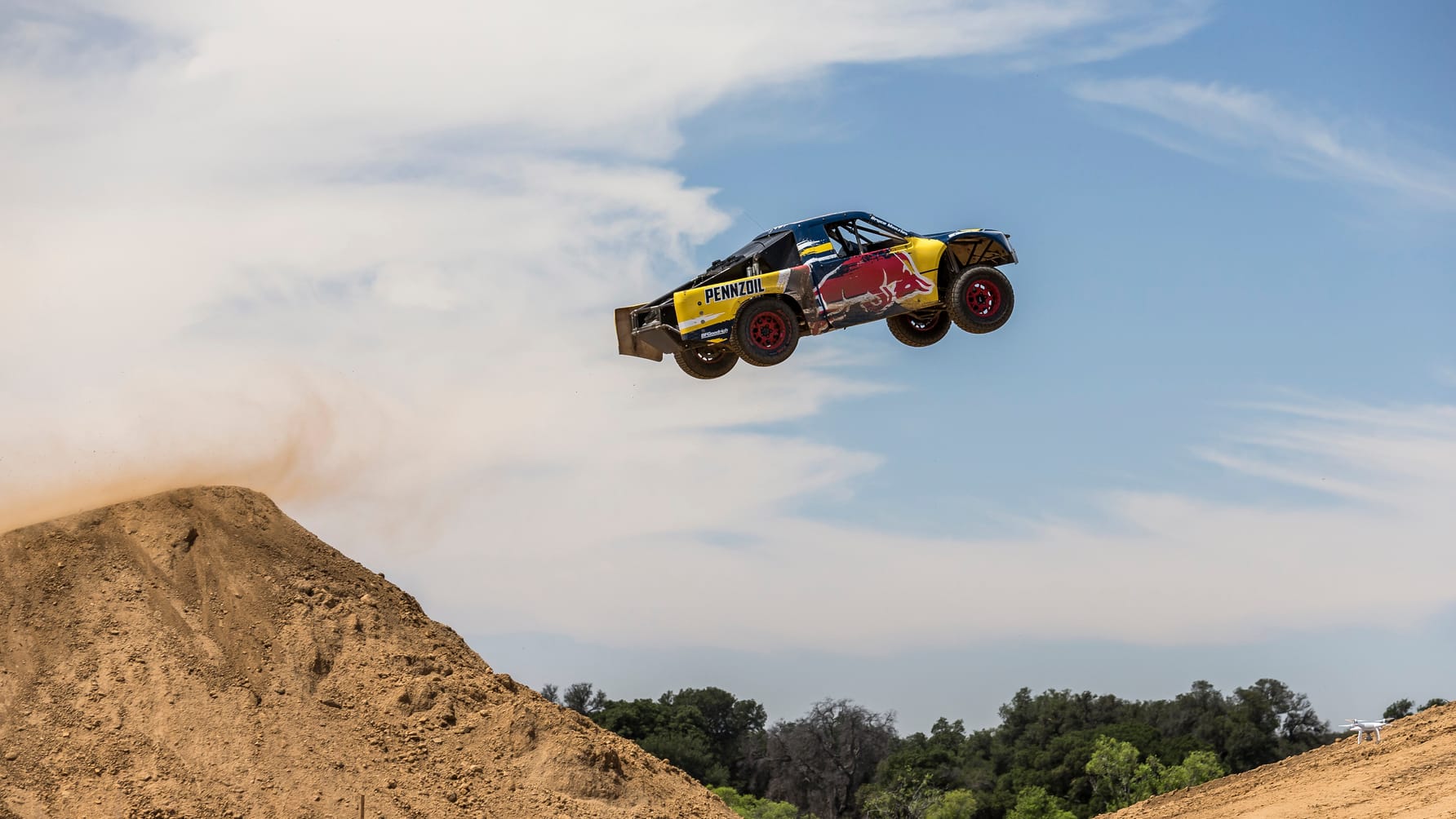 Watch an off-road truck jump over an entire village | Top Gear